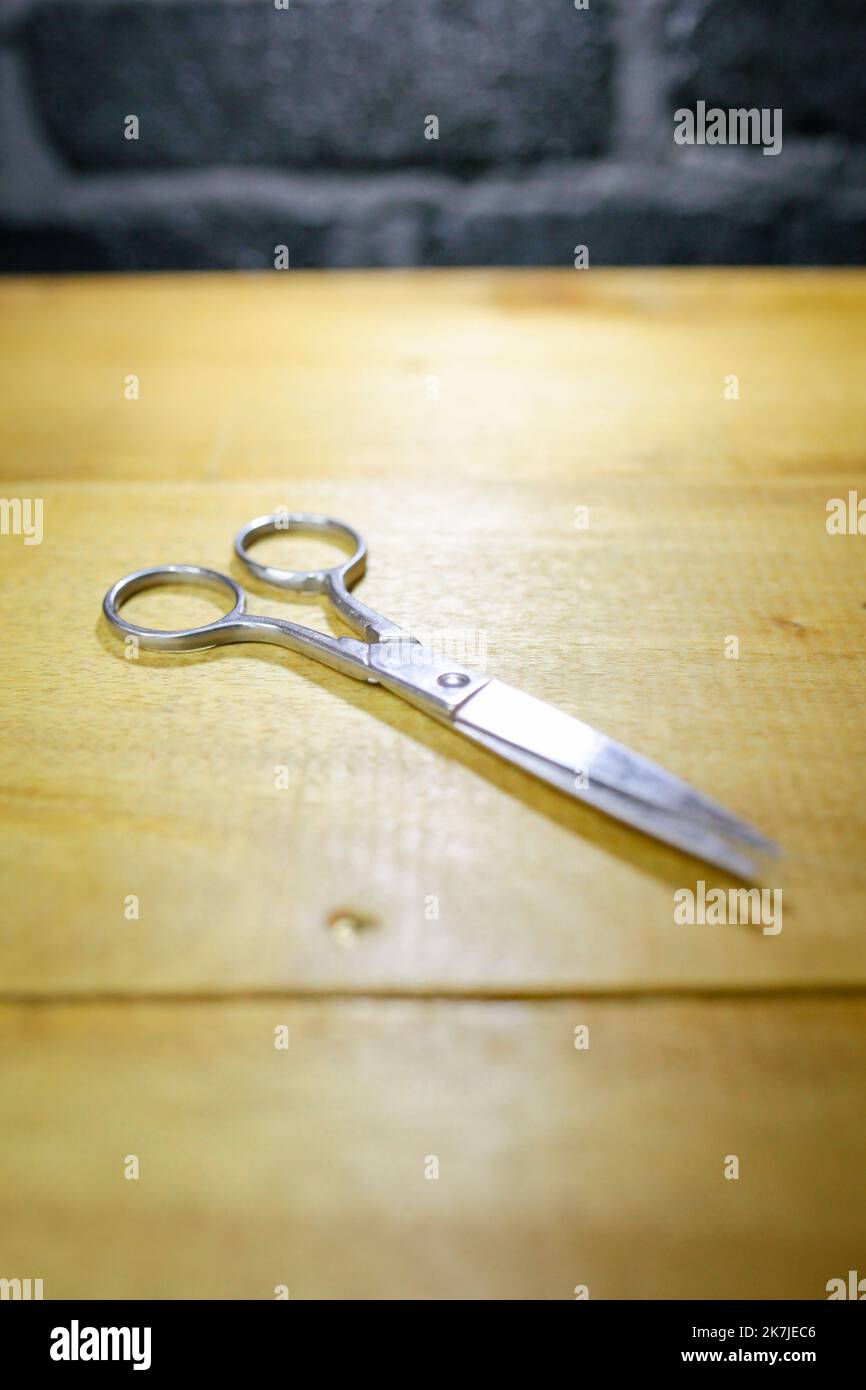 Barber scissors wooden background Stock Photo - Alamy
