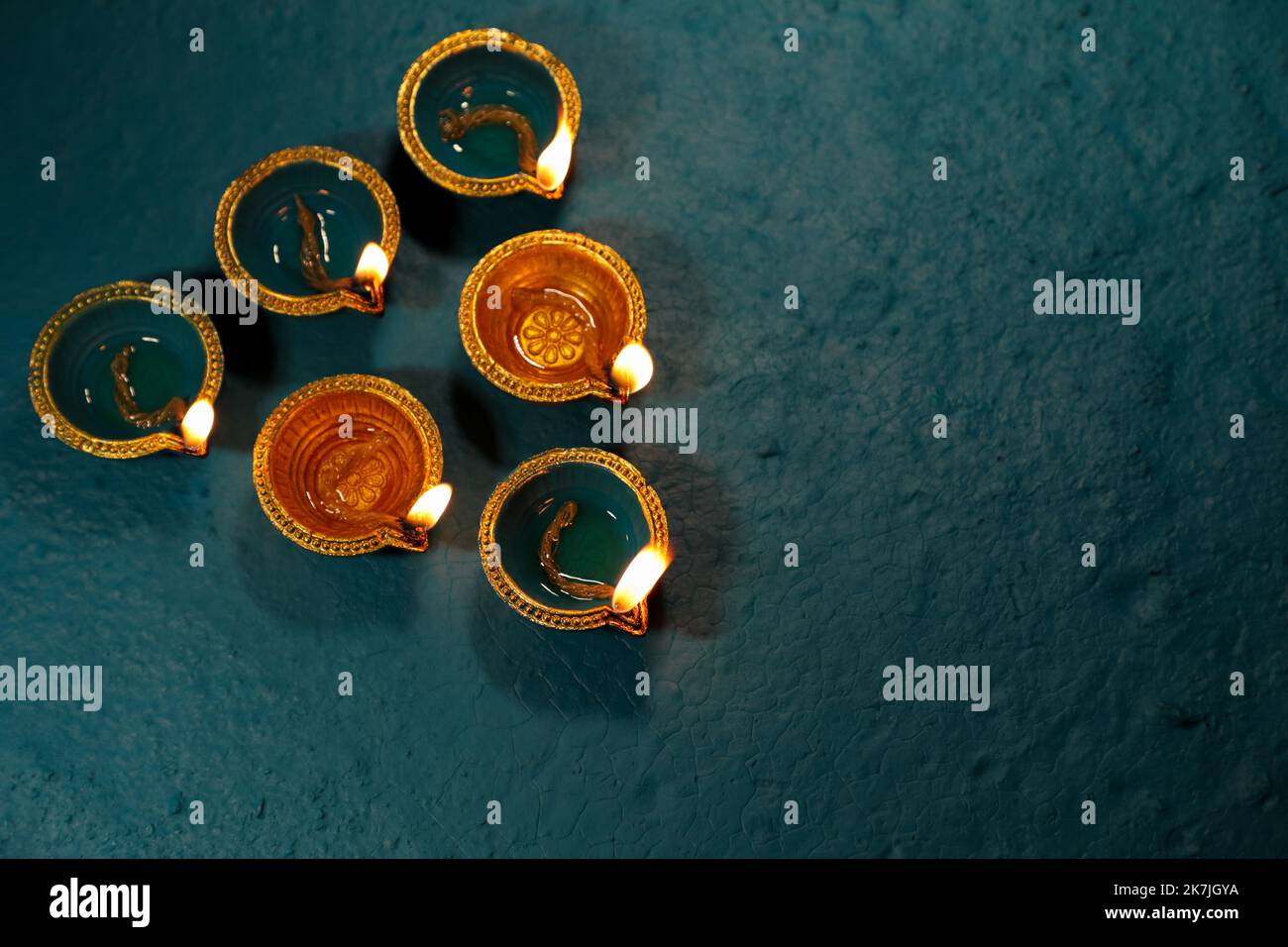 Happy Diwali Festival of Lights teal color background with teal and ...