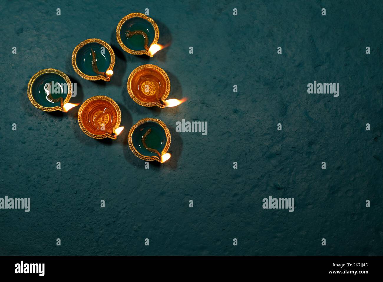 Happy Diwali Festival of Lights teal color background with teal and ...