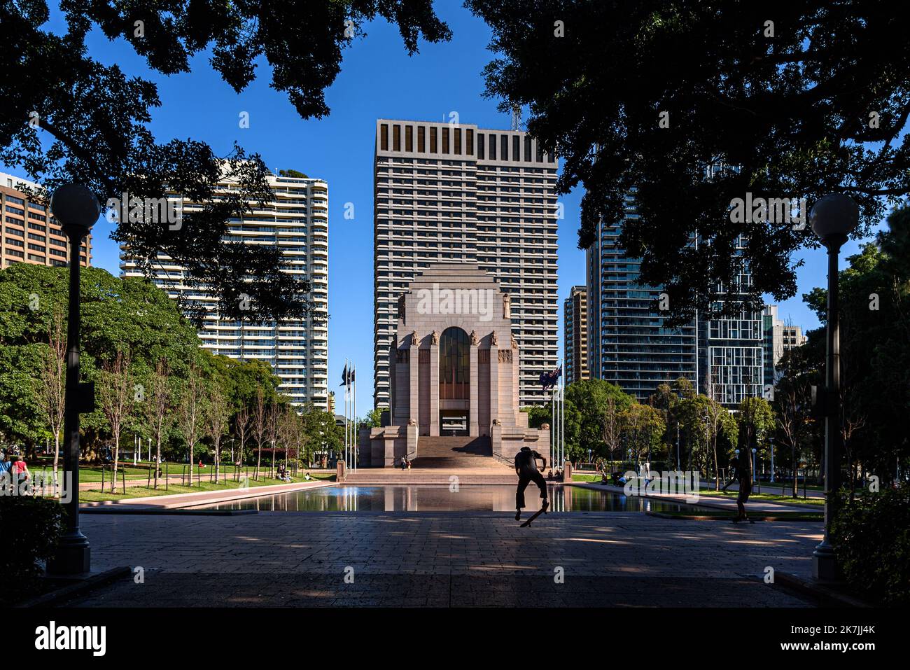 A skater doing a trick in front of the ANZAC Memorial and reflecting ...