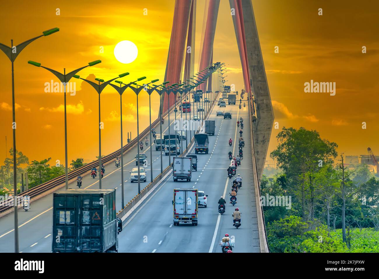 Heavy traffic on Can Tho bridge at sunset sky. Can Tho bridge is famous ...