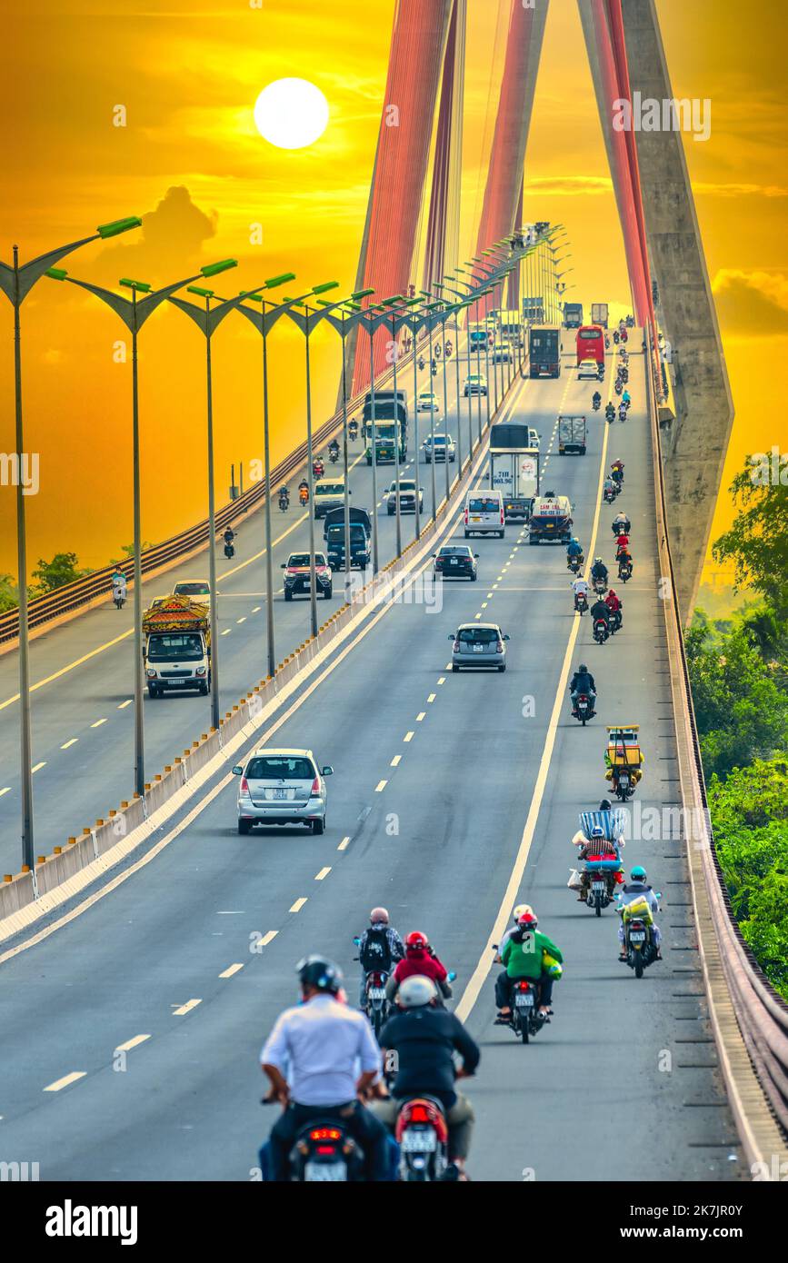 Heavy traffic on Can Tho bridge at sunset sky. Can Tho bridge is famous ...