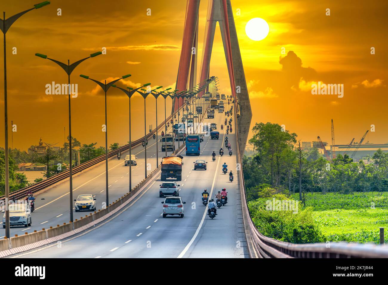 Heavy traffic on Can Tho bridge at sunset sky. Can Tho bridge is famous ...