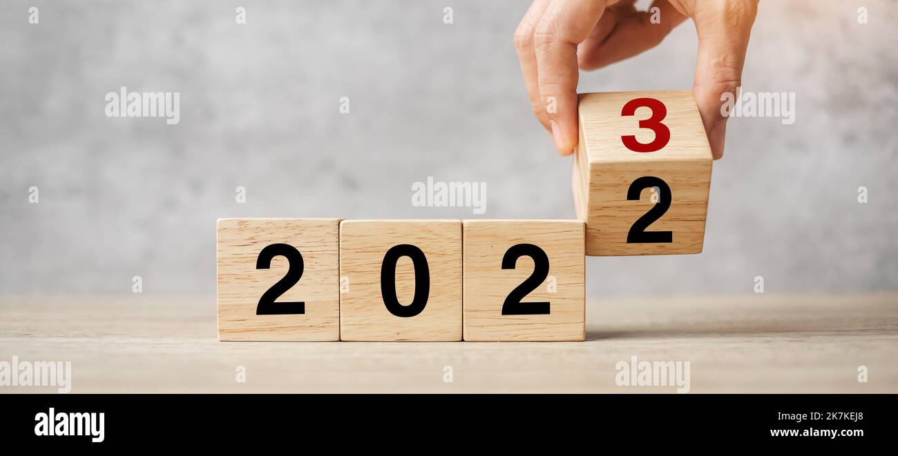 hand flipping block 2022 to 2023 text on table. Resolution, strategy ...