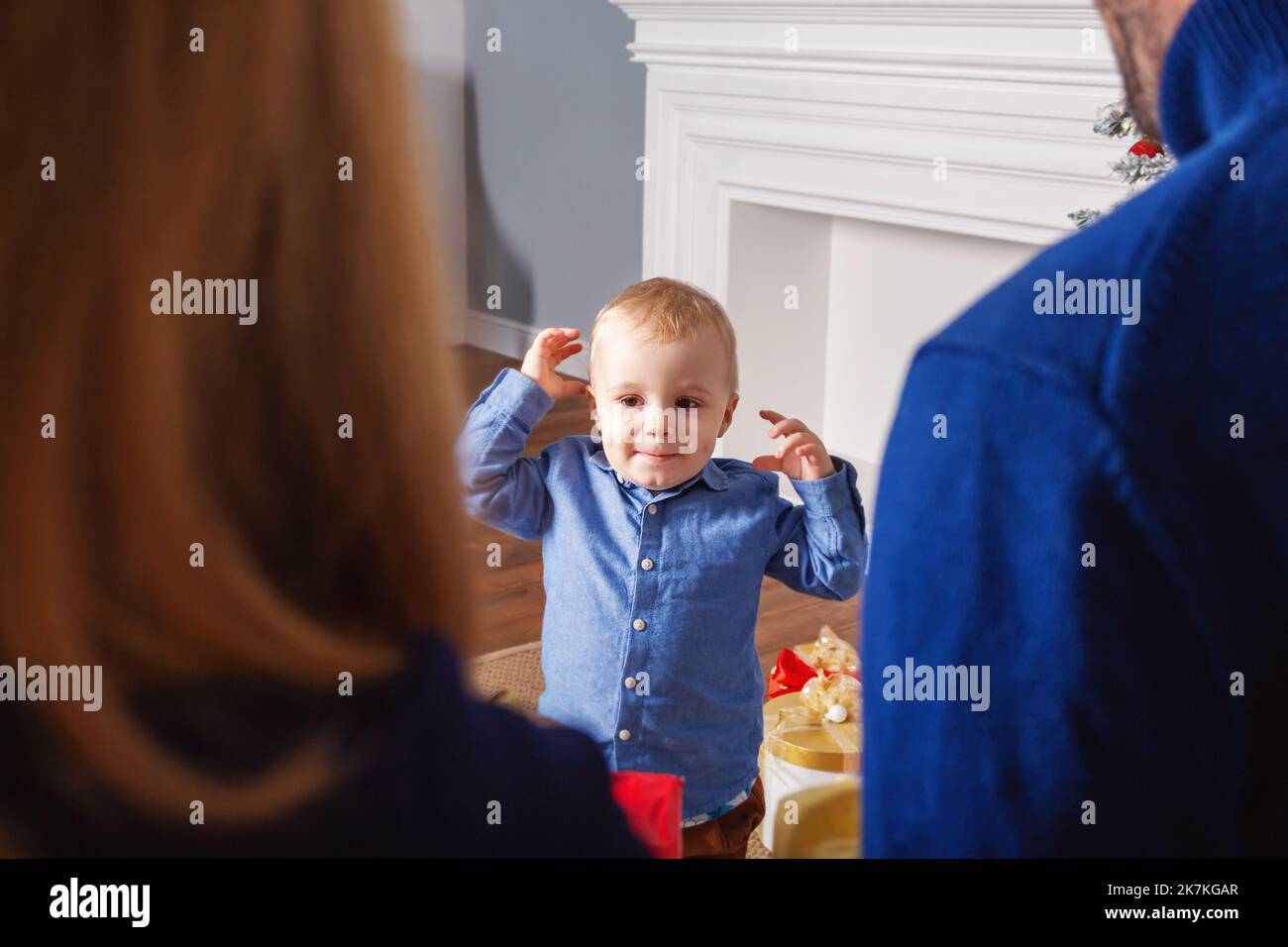 Adorable baby boy waiting gift from parents Stock Photo - Alamy