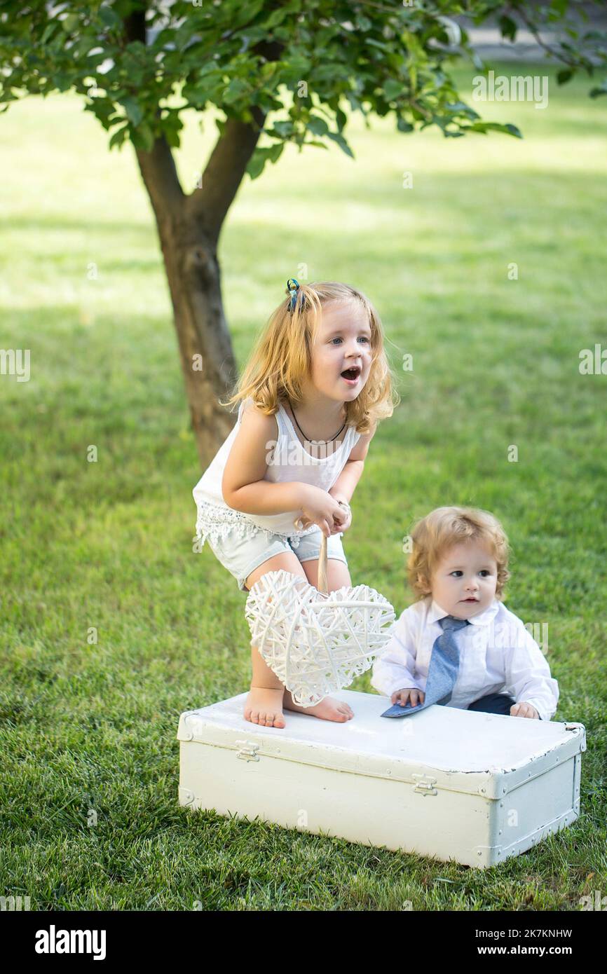 Cute little baby on the meadow field. Toddler child walking outdoor ...