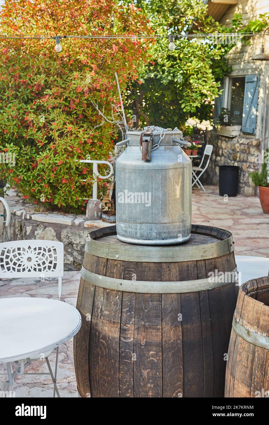 Wooden barrel for wine and metal can for milk, decoration and interior ...