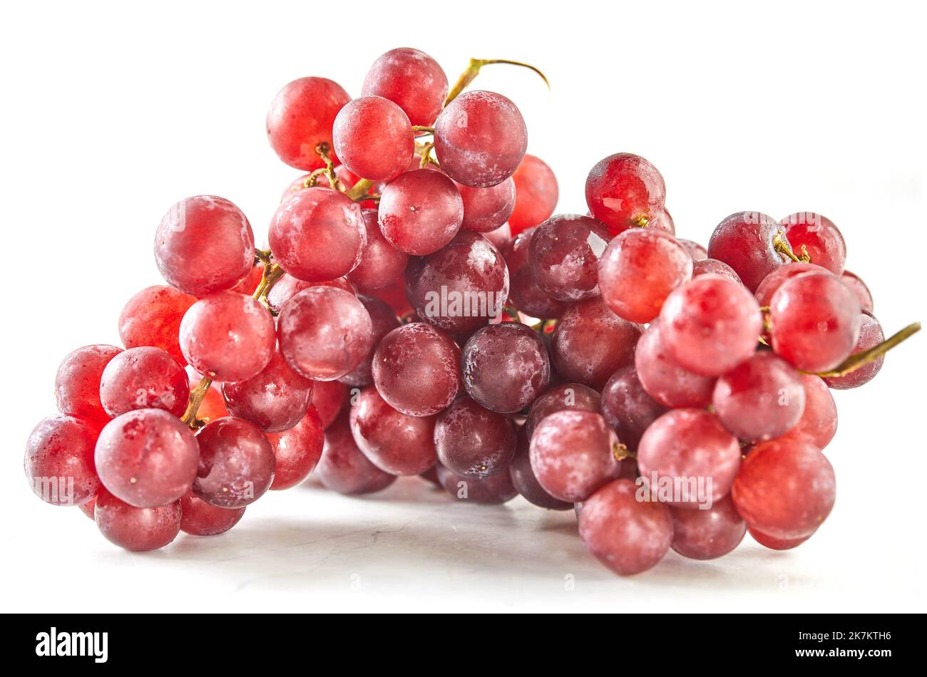 Red grapes on white marble, ready to cook and eat Stock Photo - Alamy