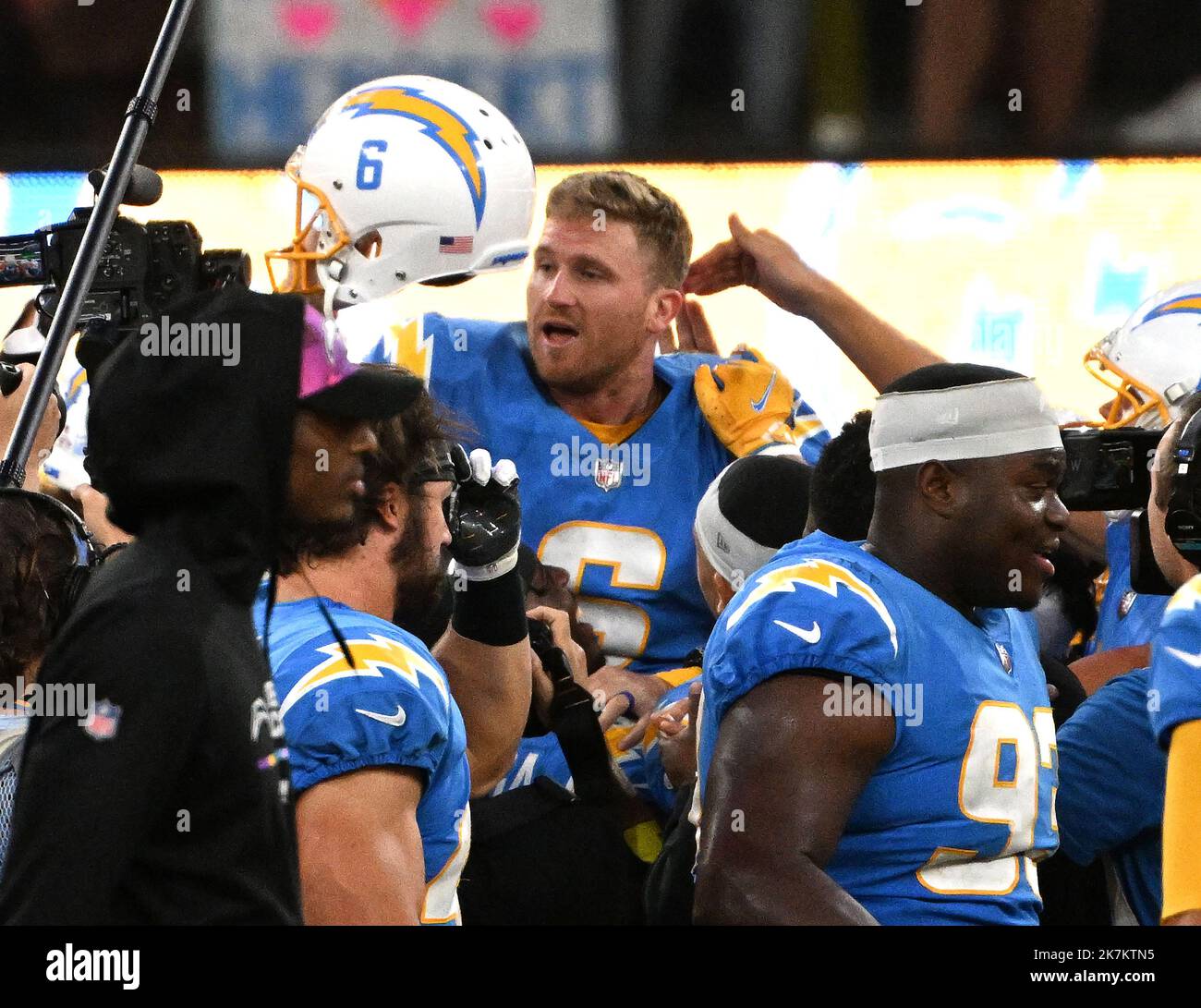 Los Angeles Chargers kicker Dustin Hopkins is lifted in the air by ...