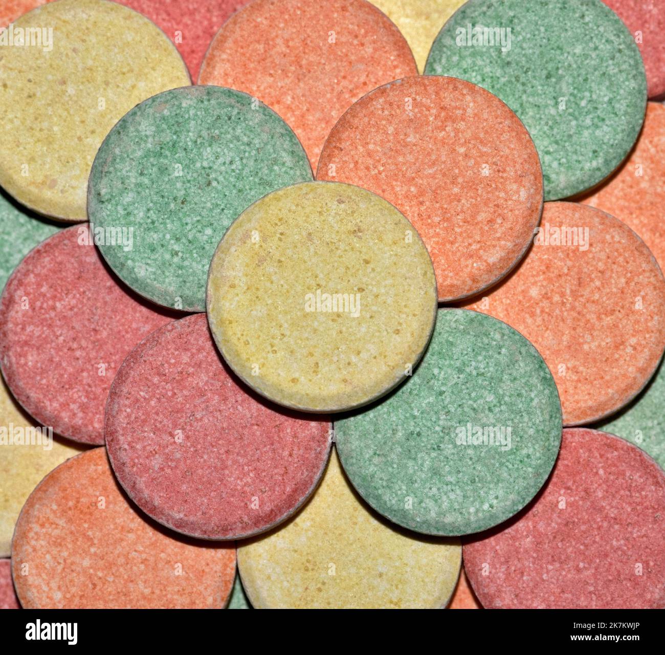 Colorful Tums antacid pills stacked into a pyramid. Abstract closeup ...