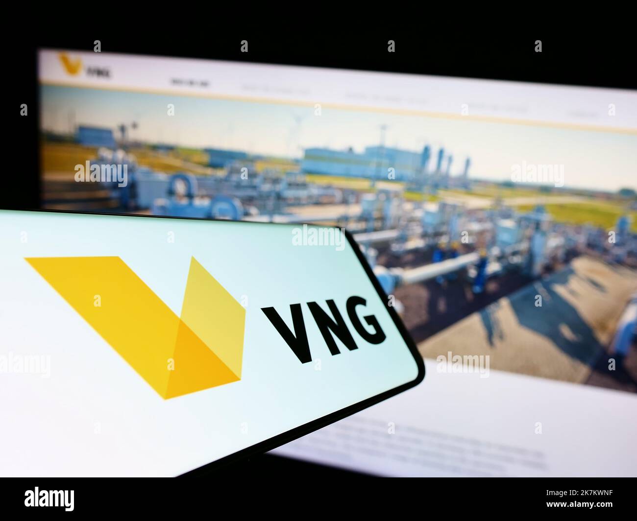 Mobile phone with logo of German energy company VNG AG on screen in ...