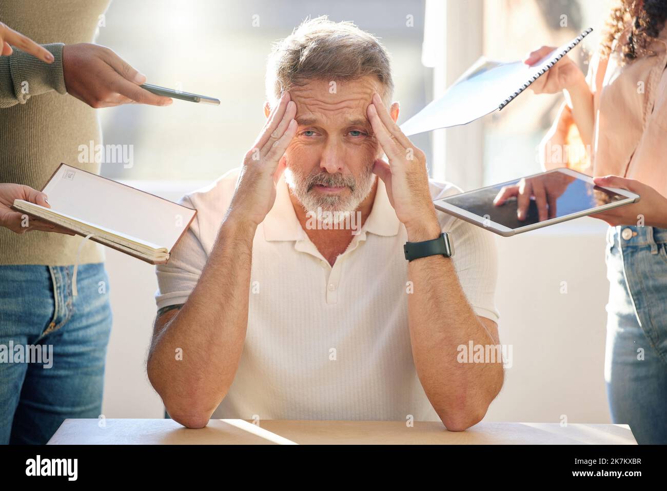 Stuck in a dance of collapsing walls. a mature businessman looking ...