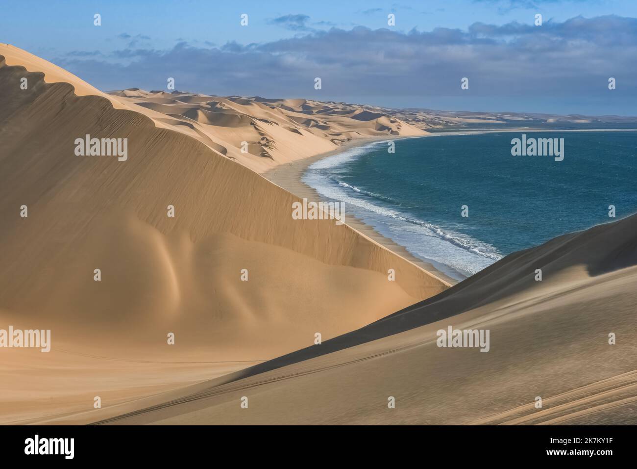 Namibia, the Namib desert, landscape of yellow dunes falling into the ...