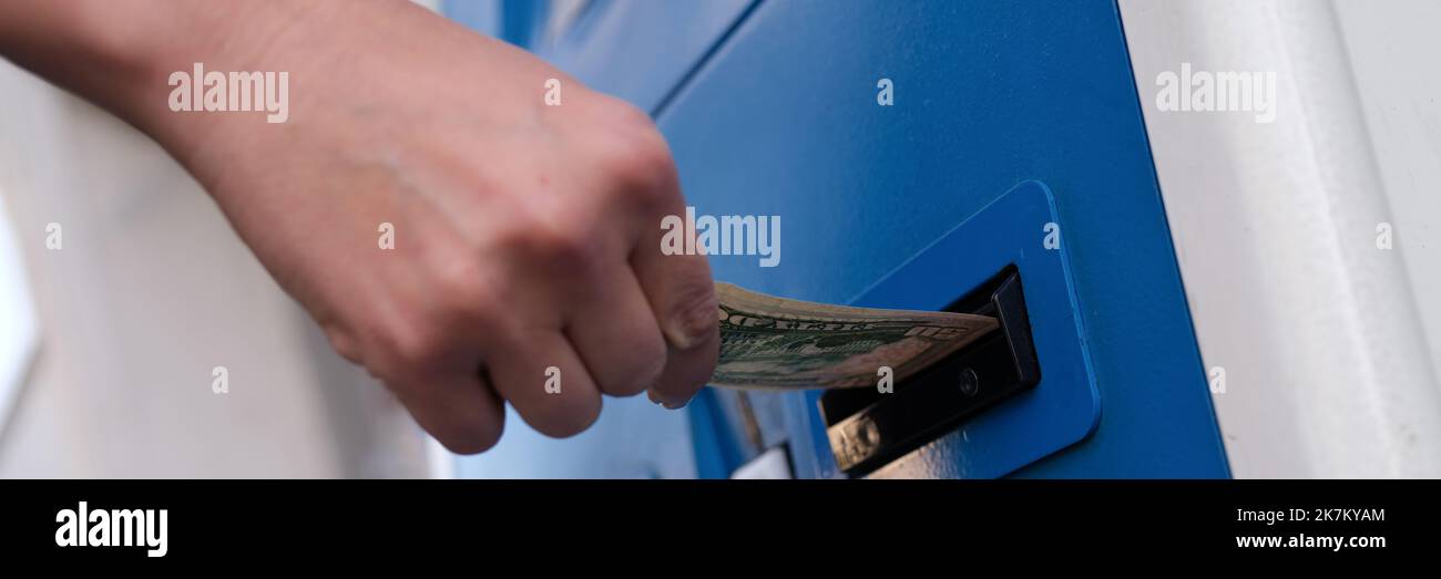 Replenishment of dollars in cash at ATM money in hand Stock Photo - Alamy
