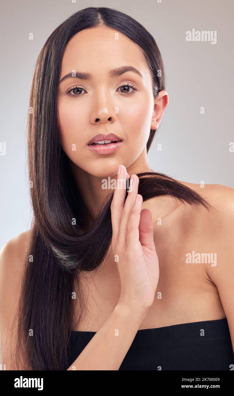 No split ends is a sign of healthy hair. an attractive young woman ...