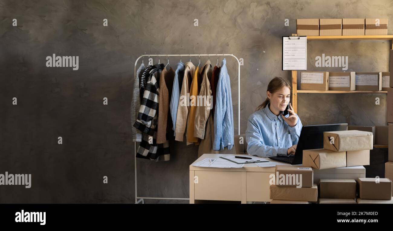 SME business women use laptop computer checking customer order online ...