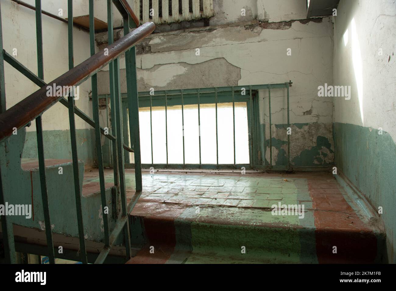 old dirty staircase without repair with a staircase in a residential ...