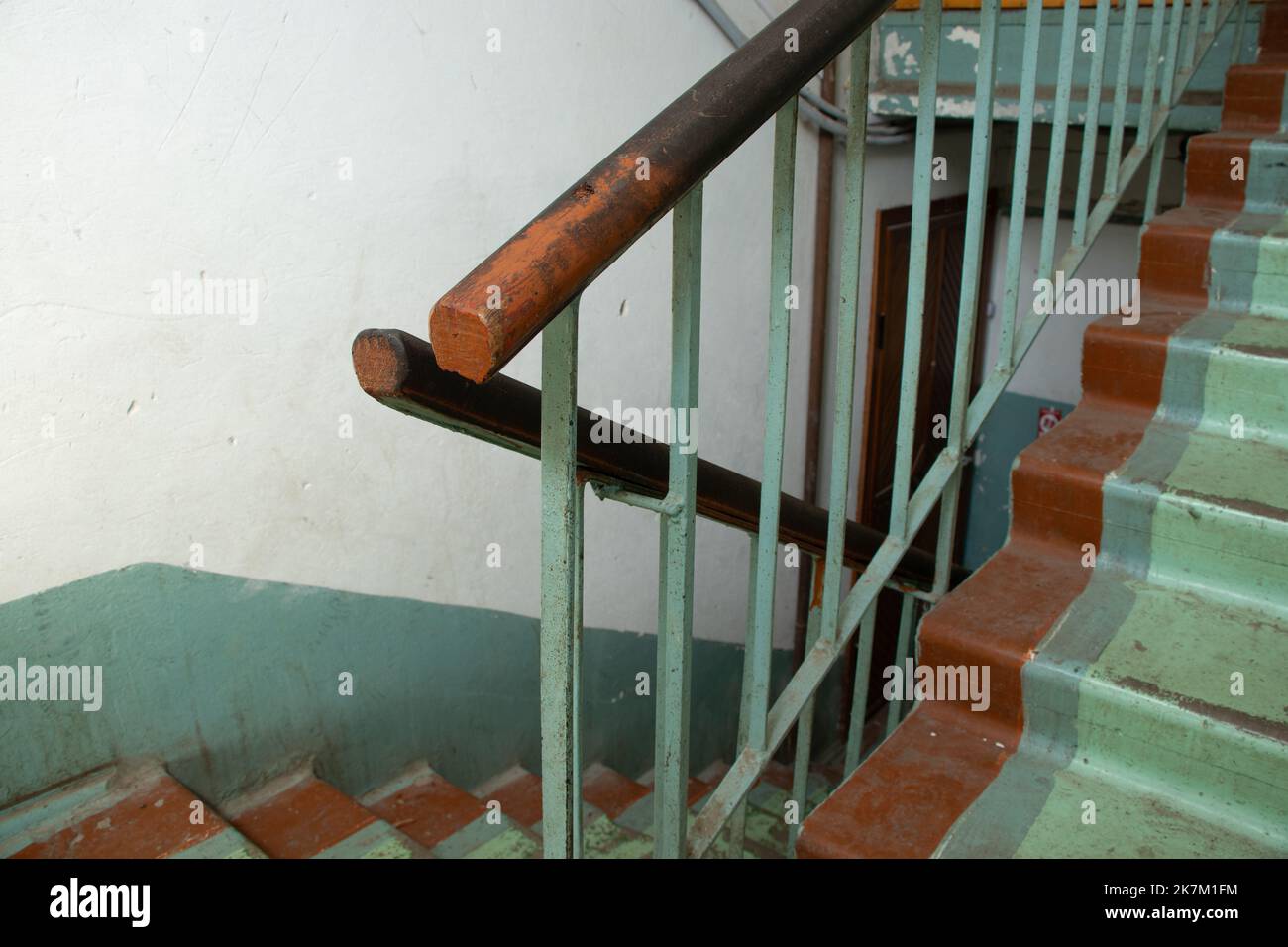 old dirty staircase without repair with a staircase in a residential ...