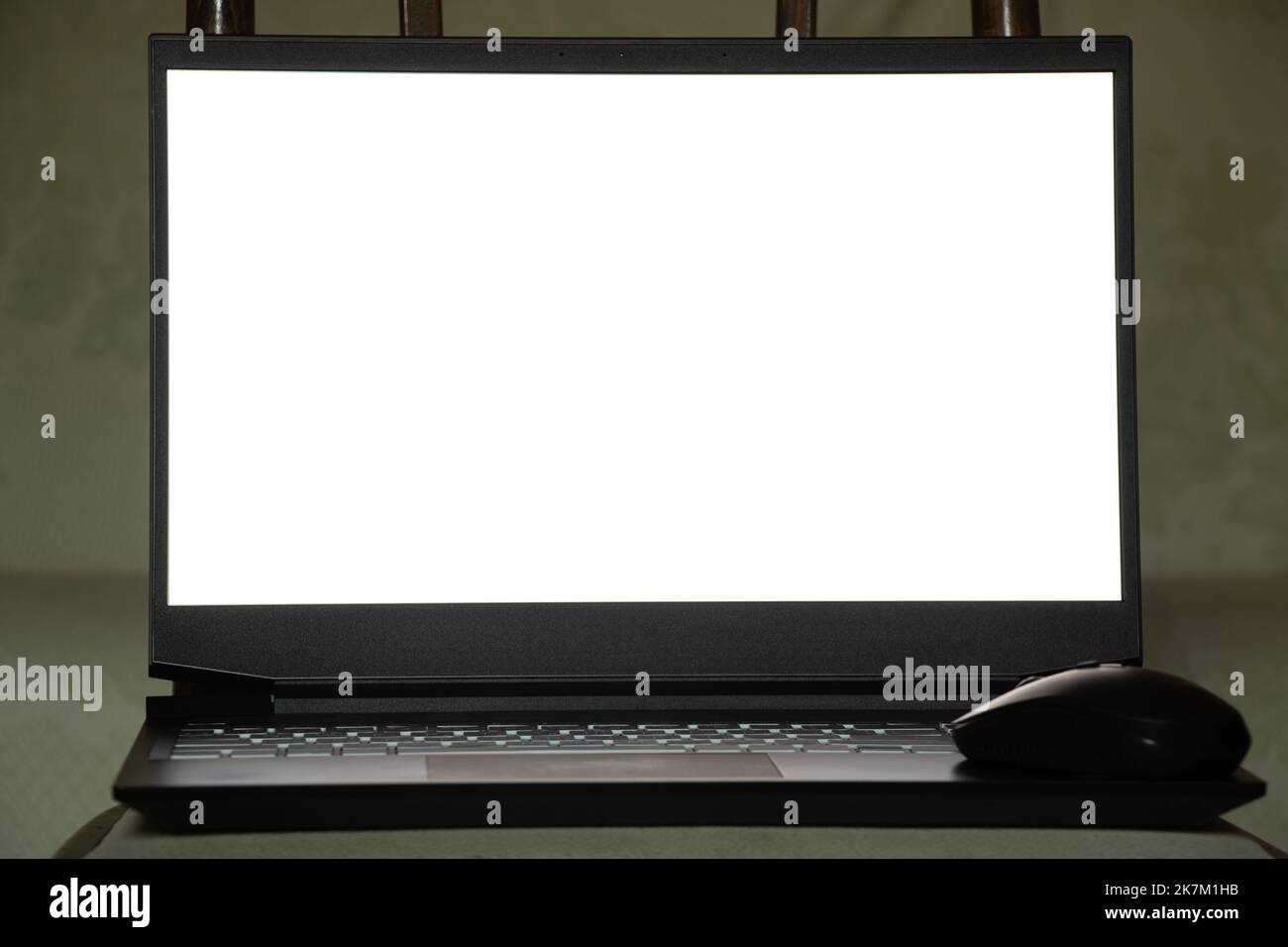 black laptop with white screen stands on the kitchen on the table at ...