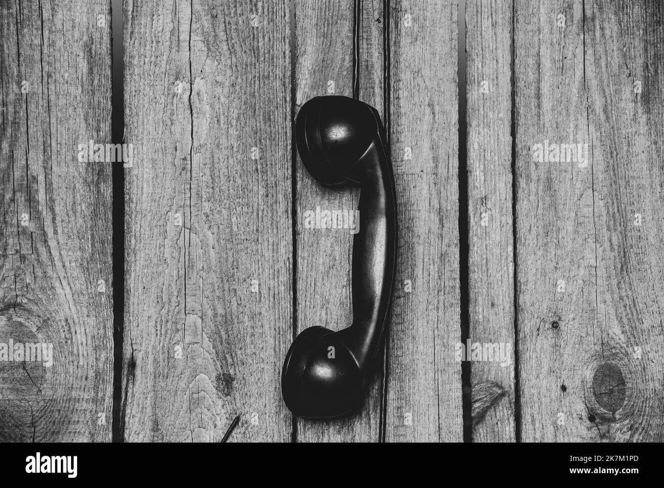 Vintage telephone hanging on the wall Black and White Stock Photos ...