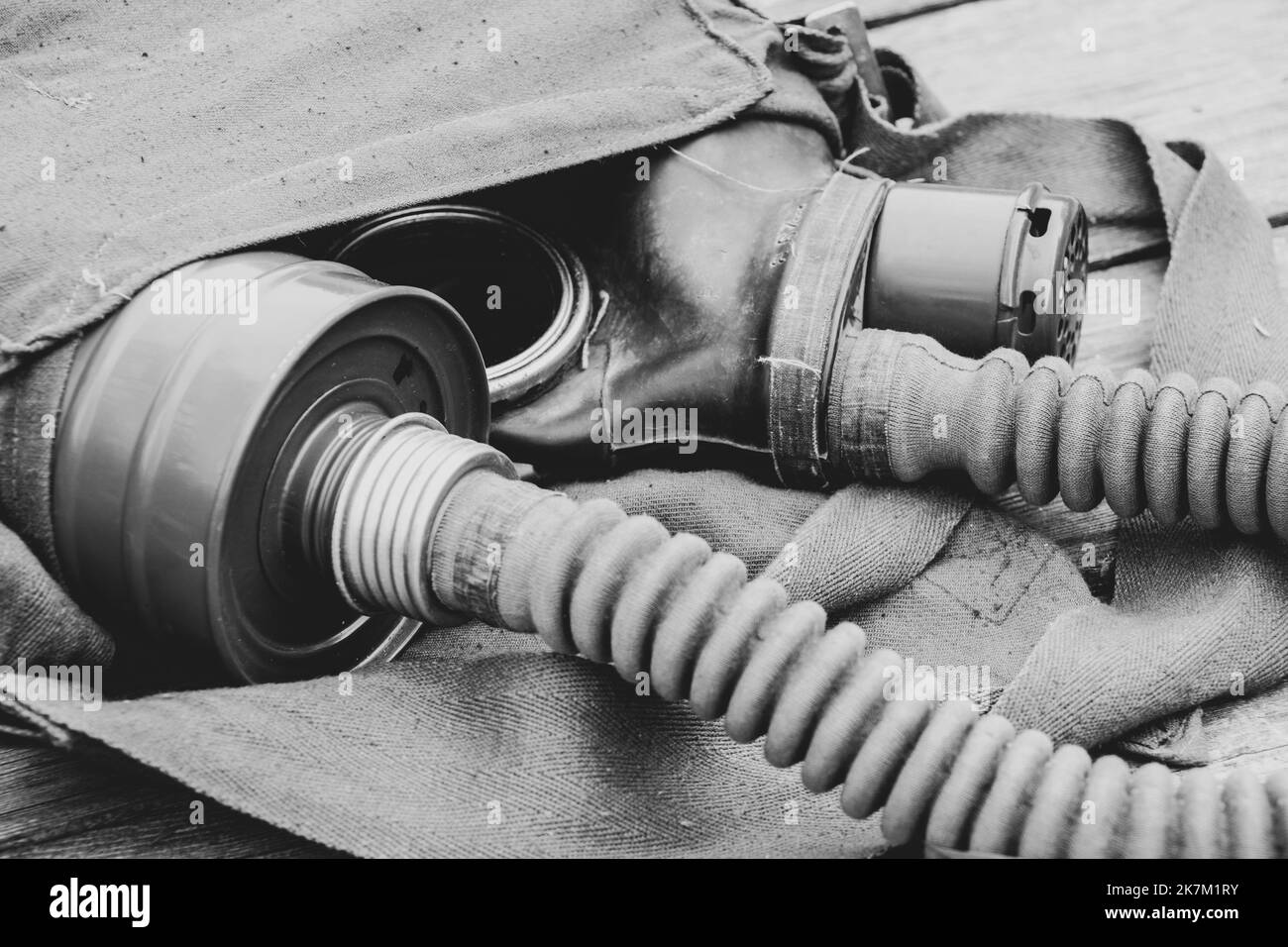 Vintage gas mask lies on a wooden background, gas attack in Ukraine in ...