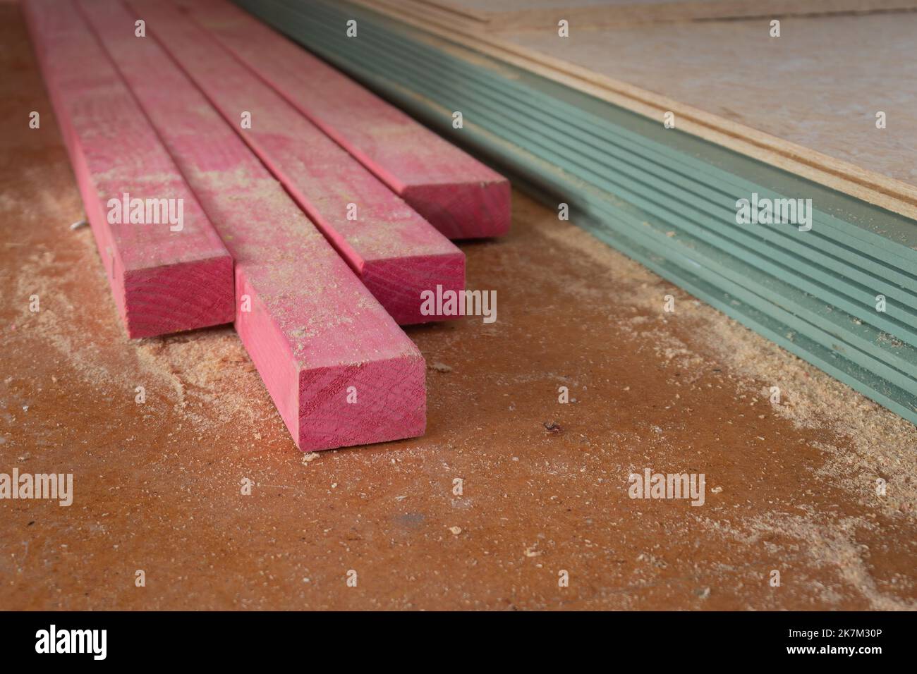 Building woods and GIB plasterboards with saw dust around. Home ...