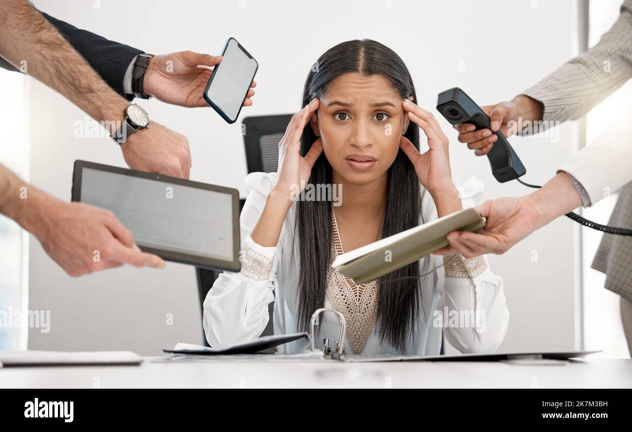 A stressful day. a young businesswoman feeling stressed out in a ...