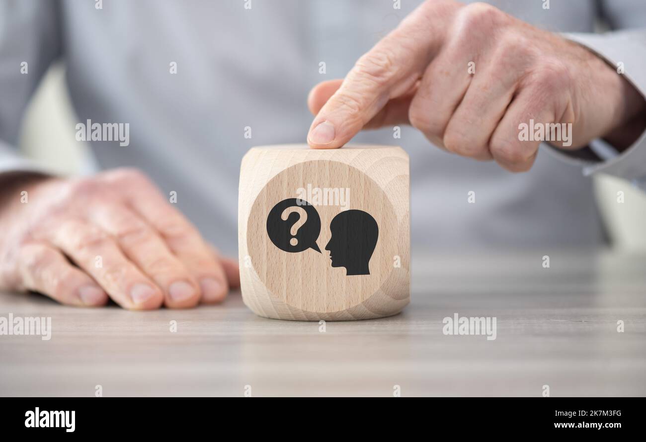 Wooden block with symbol of question concept Stock Photo - Alamy