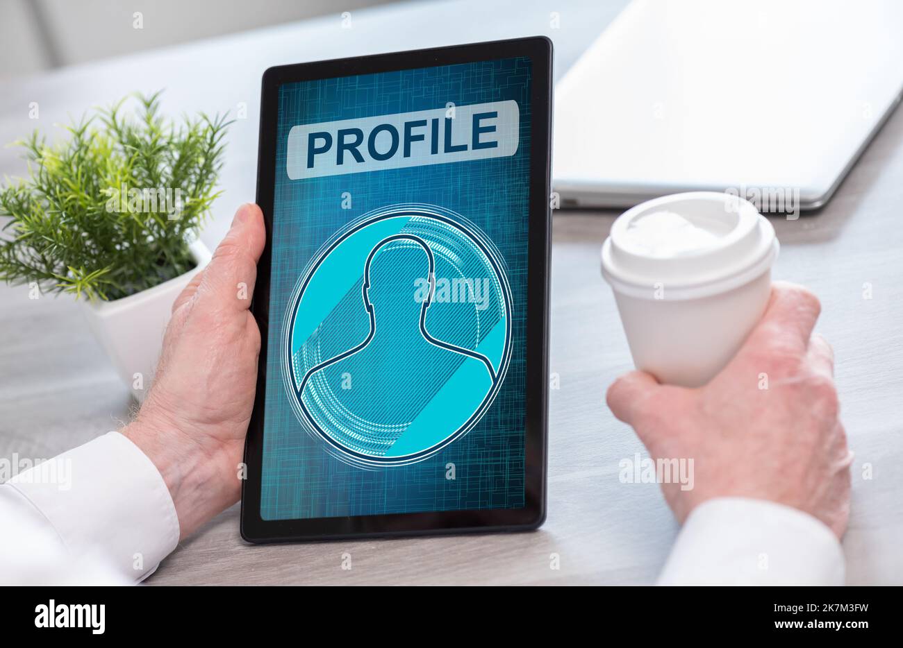 Tablet screen displaying a profile concept Stock Photo - Alamy