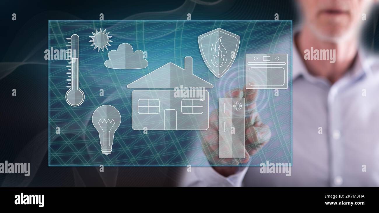 Man touching a smart home concept on a touch screen with his finger ...