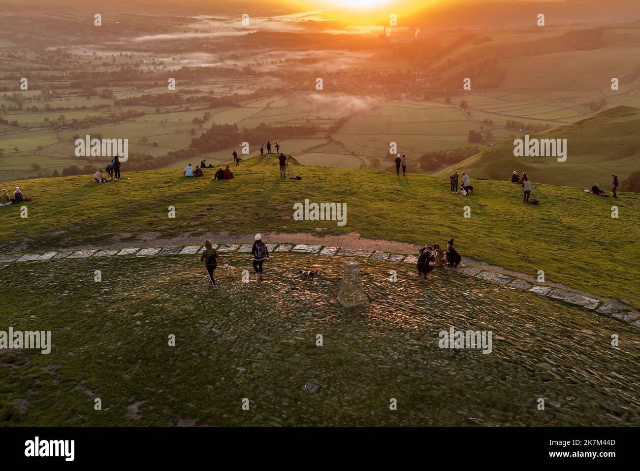 Early morning walkers head to the summit of Mam Tor to watch the ...