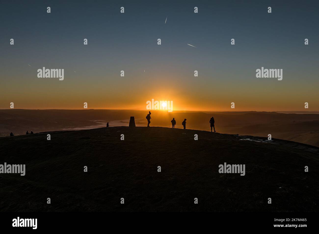 Early morning walkers head to the summit of Mam Tor to watch the ...