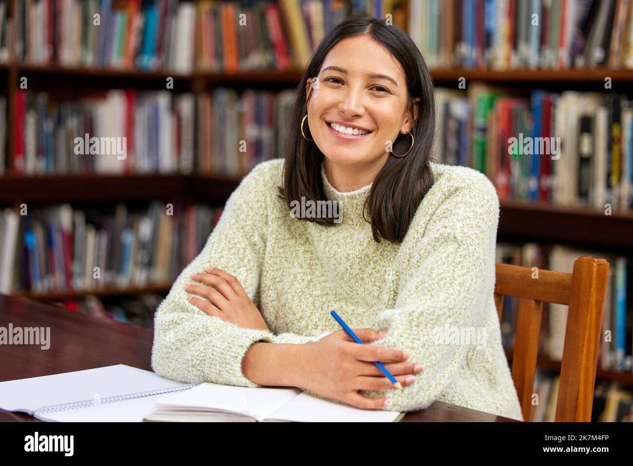 No libraries, no progress. a young woman studying in a college library ...