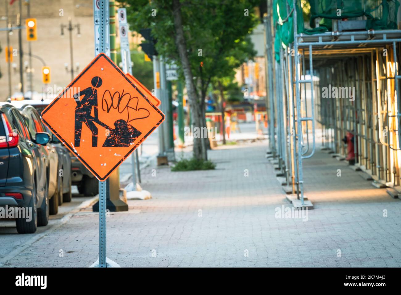 Construction dig sign on Winnipeg sidewalk Stock Photo - Alamy