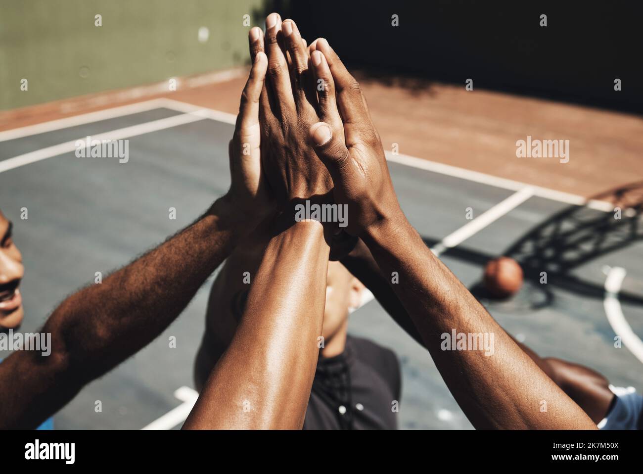 Sports friends, men or high five on basketball court in success game ...