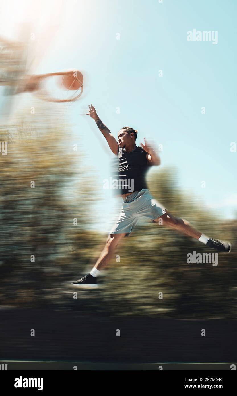 Basketball, sports and goals with man and jump in park court training ...