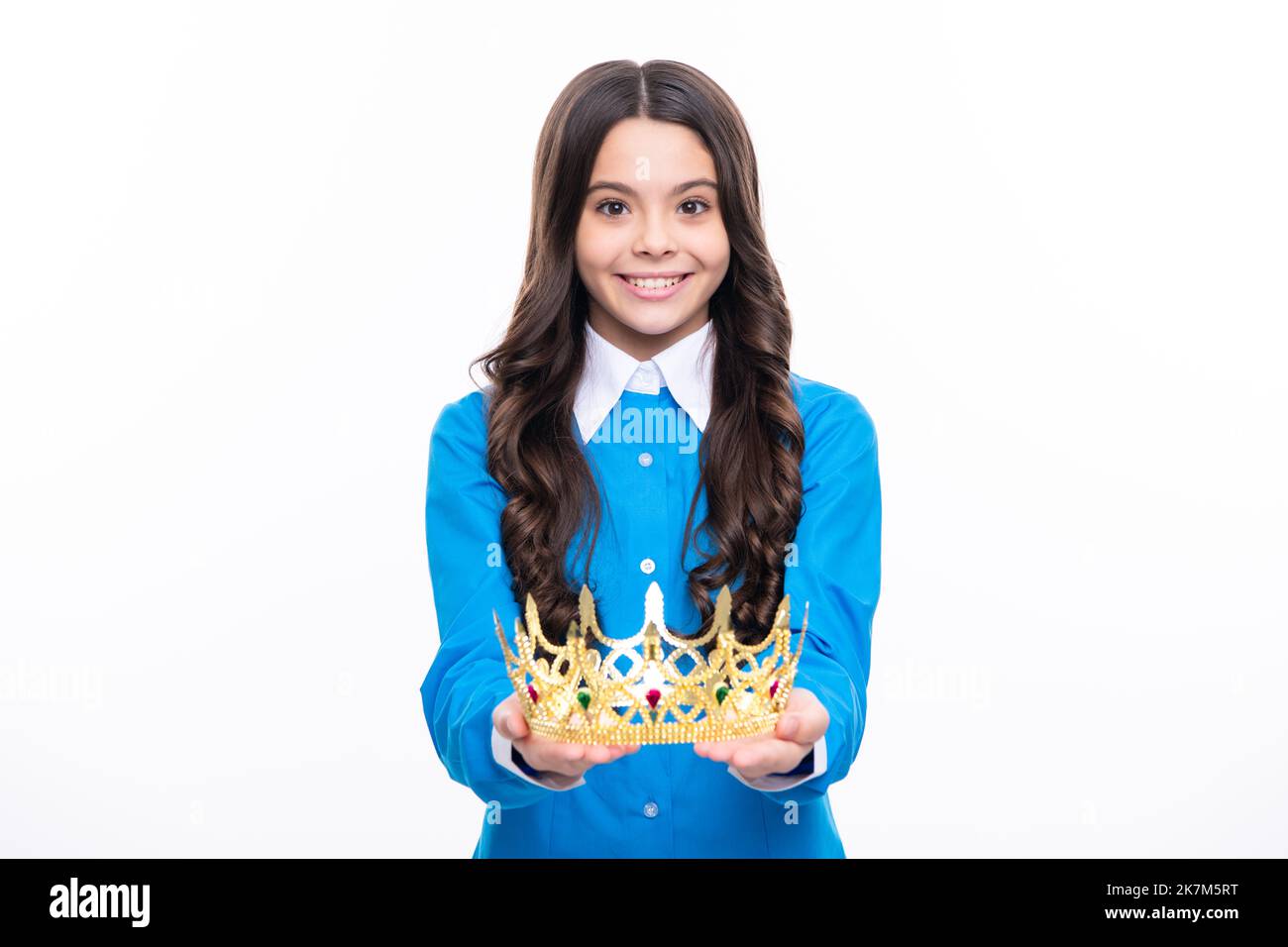 Little queen wearing golden crown. Teenage girl princess holding crown ...