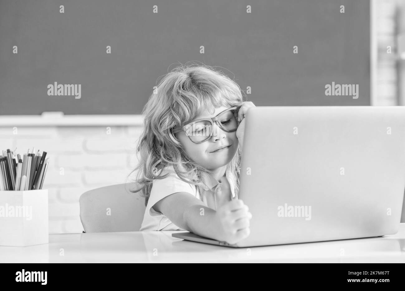 child studying on computer. teen boy in classroom. back to school ...