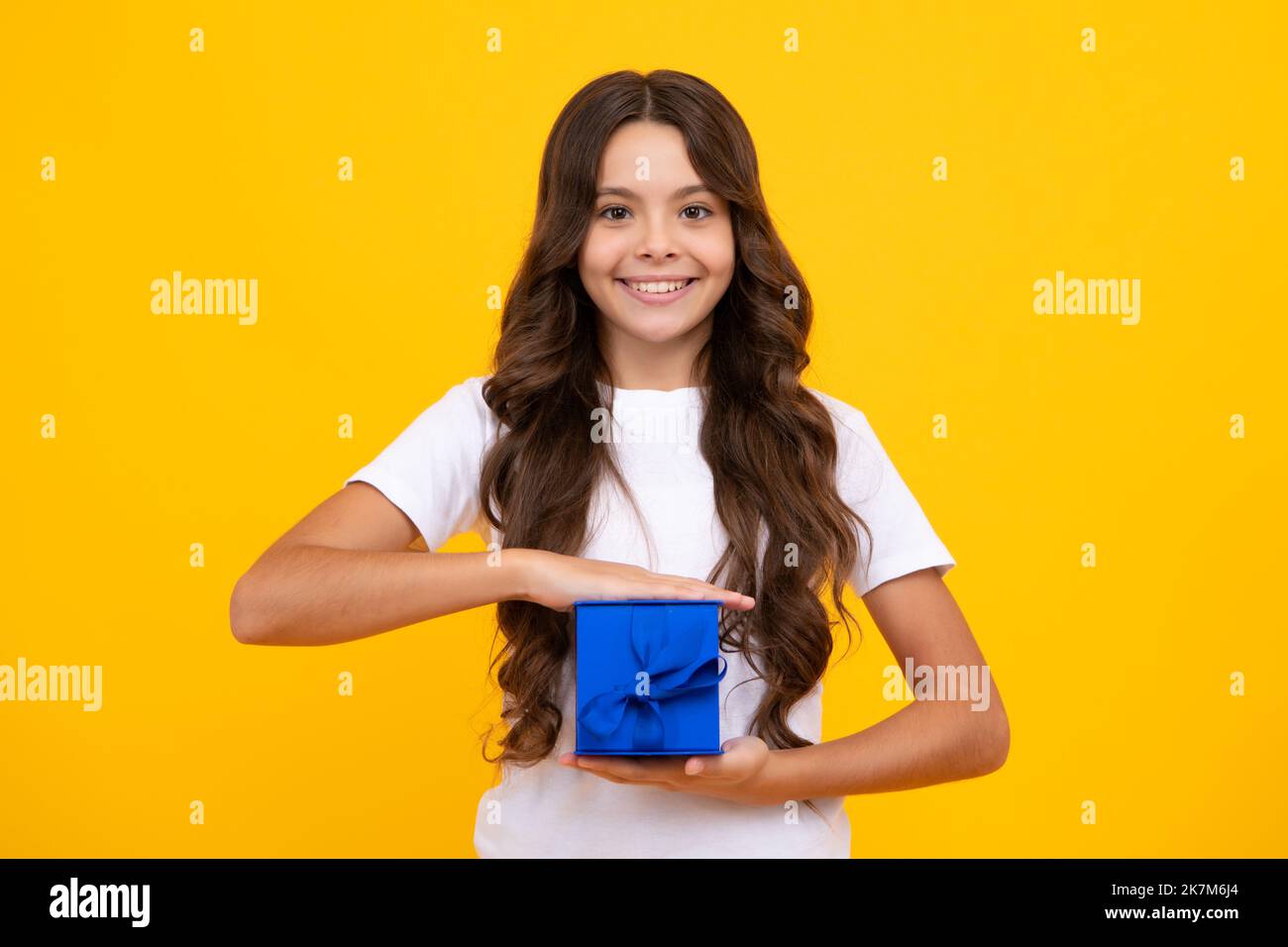 Teenager kid with present box. Teen child girl giving birthday gift ...