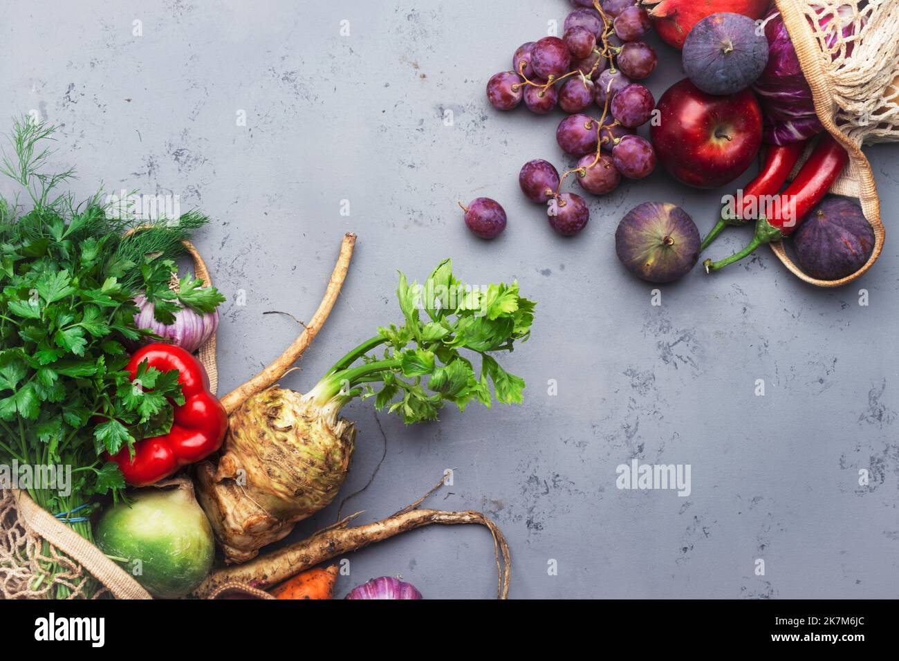 Autumn food background with vegetables, root crops and purple fruits in ...