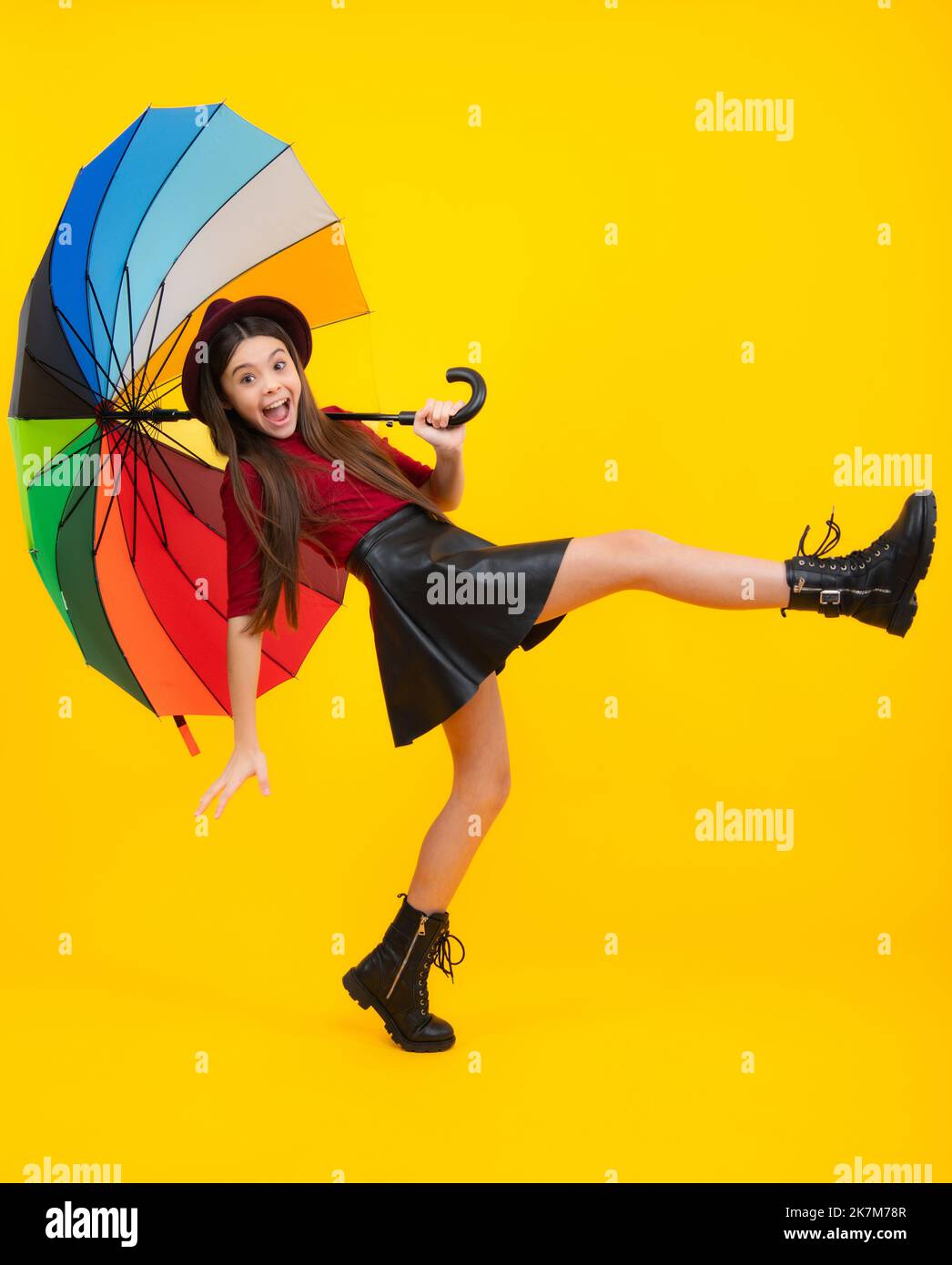 Child wuth umbrella under rain. Rainy weather, seasonal autumn. Excited ...