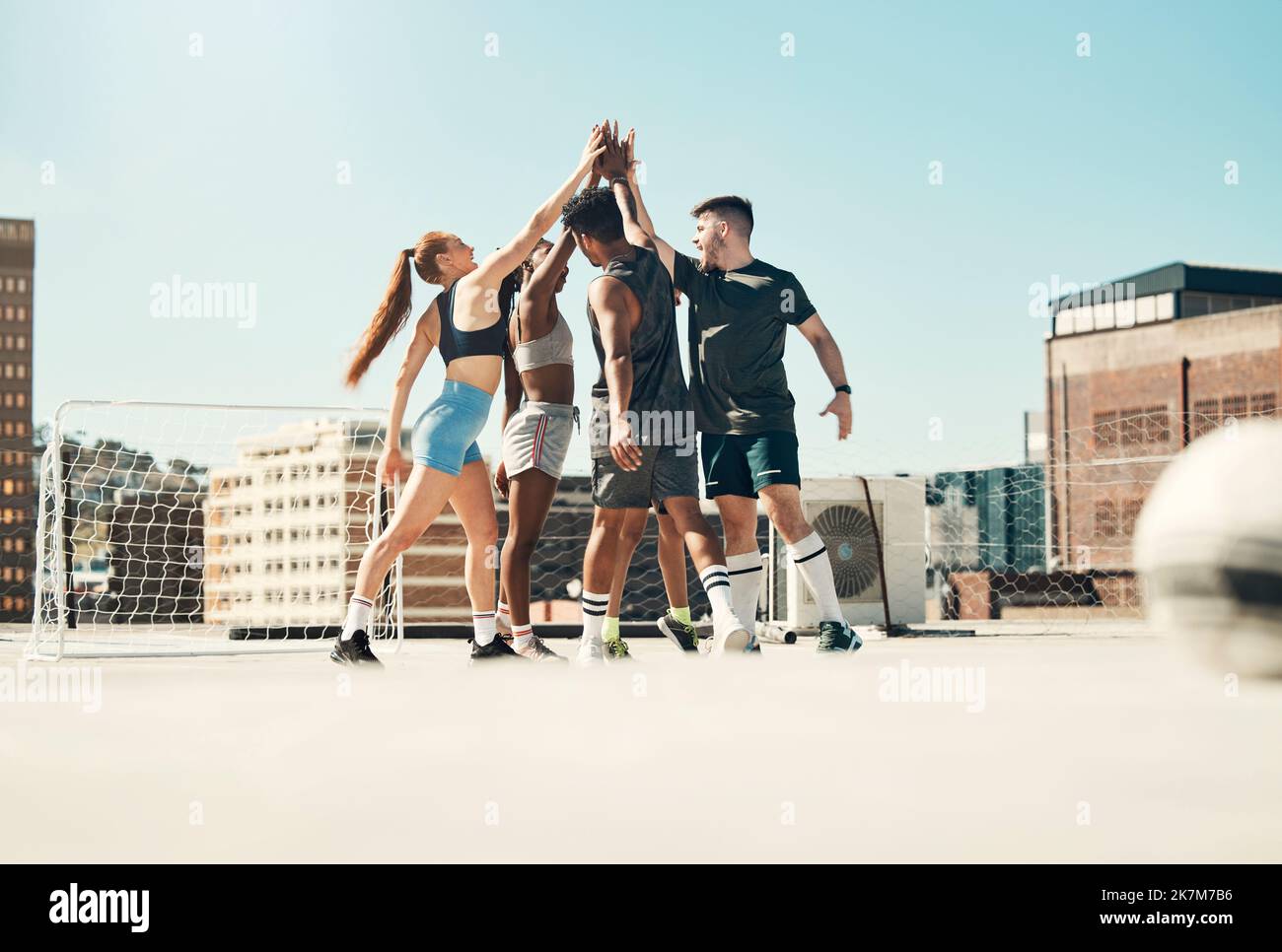 Teamwork, football and high five with people and sports training for ...