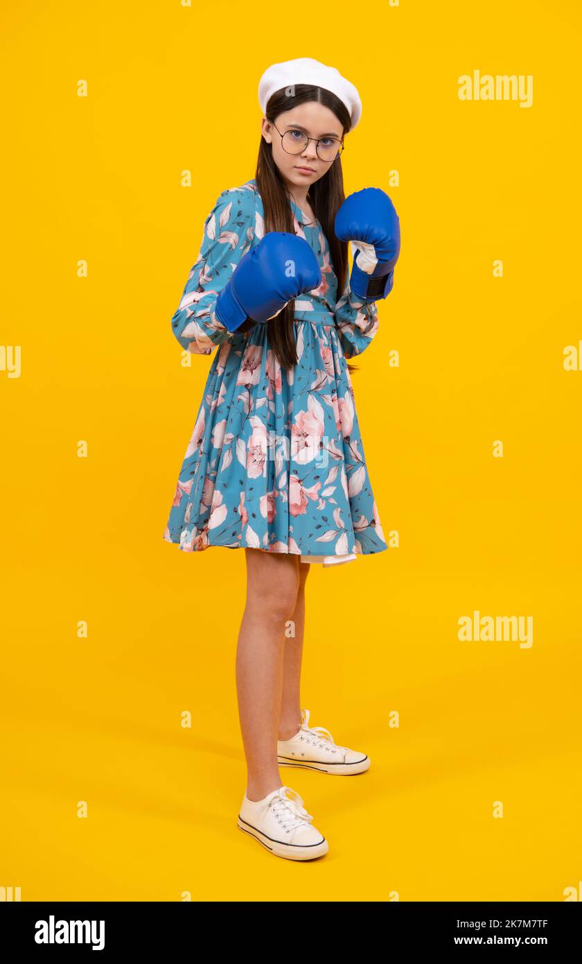 Teenage Fun Boxer Girl In Boxing Gloves On Yellow Isolated Background