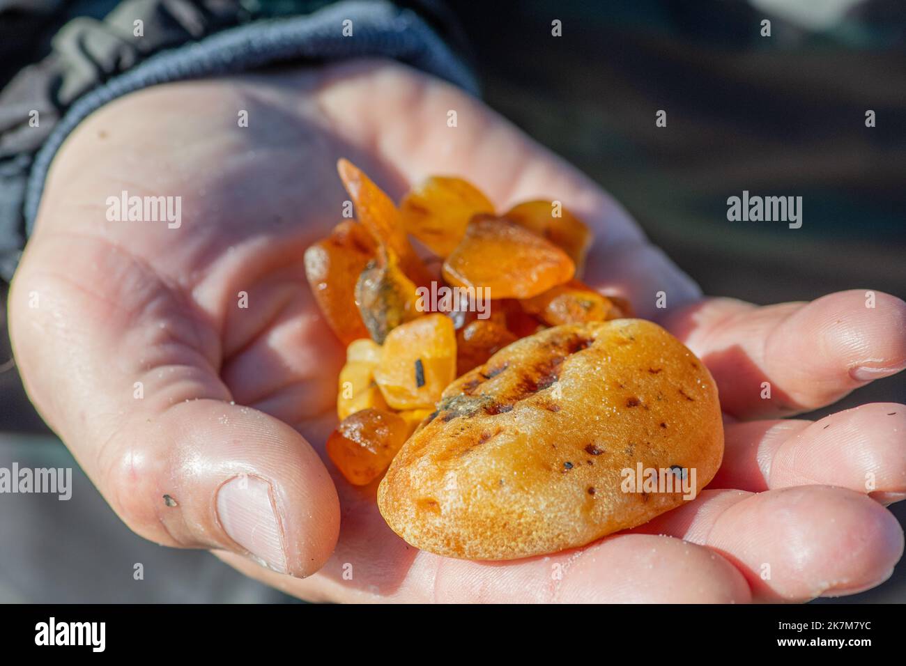 Hand and amber hi-res stock photography and images - Alamy