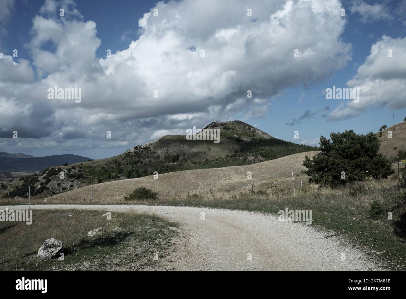 landscape in light and shadow with dirt road in Sicily, Italy Stock ...