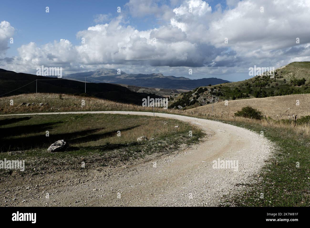 landscape in light and shadow with dirt road in Sicily, Italy Stock ...