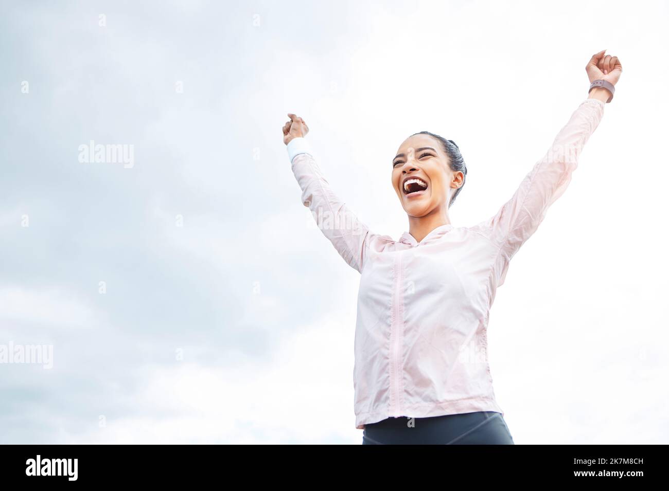 Excited, fitness success and winning woman with power sign, exercise ...