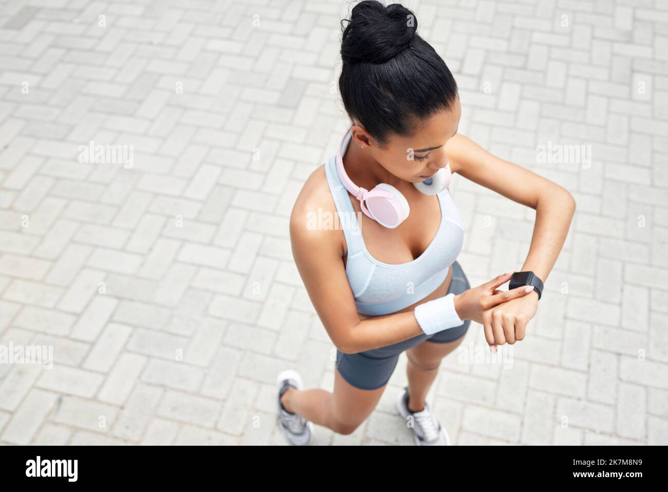 Exercise, runner and black woman with digital smartwatch to track steps ...