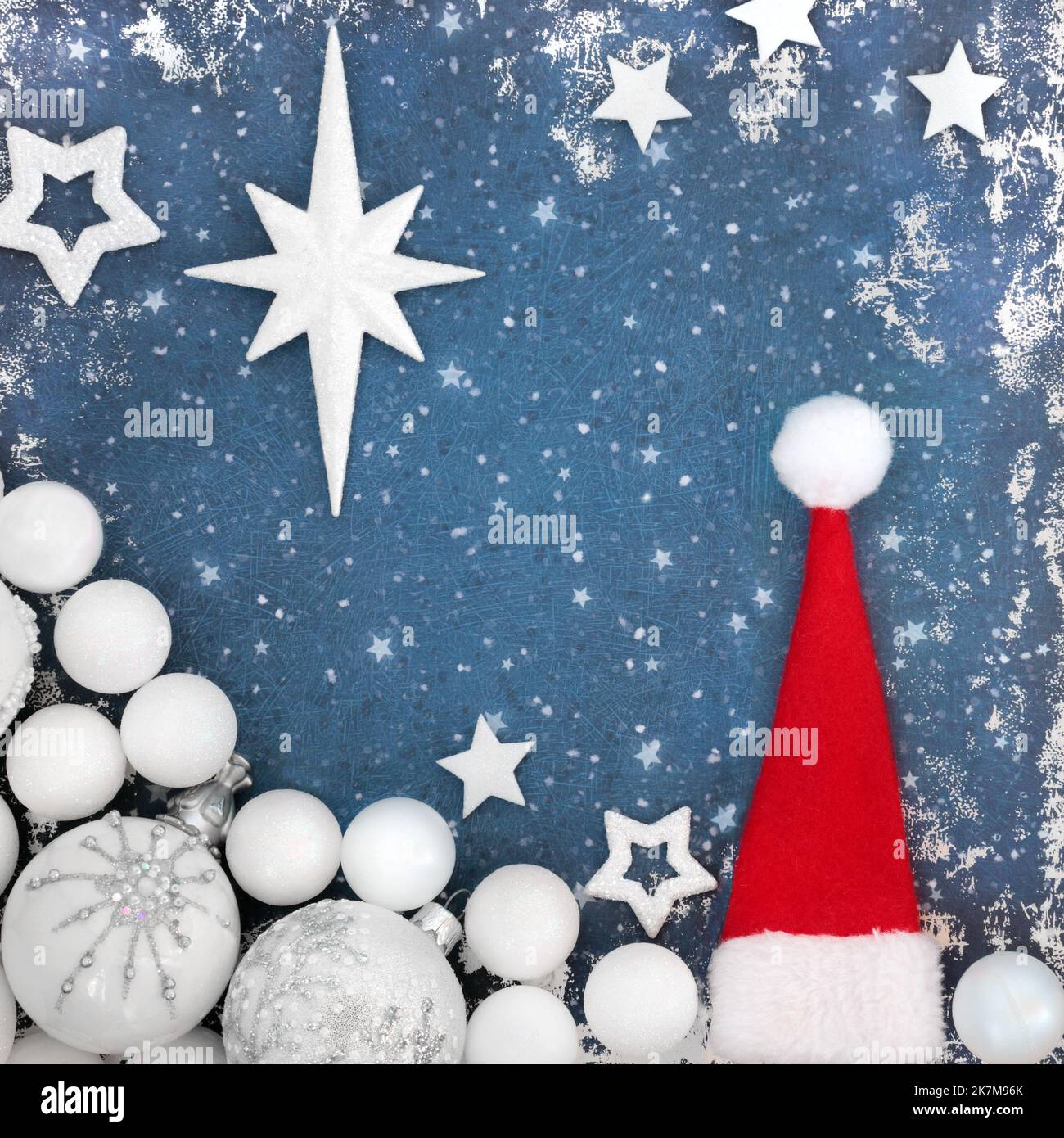 Christmas Eve fantasy background with santa hat and tree bauble ...