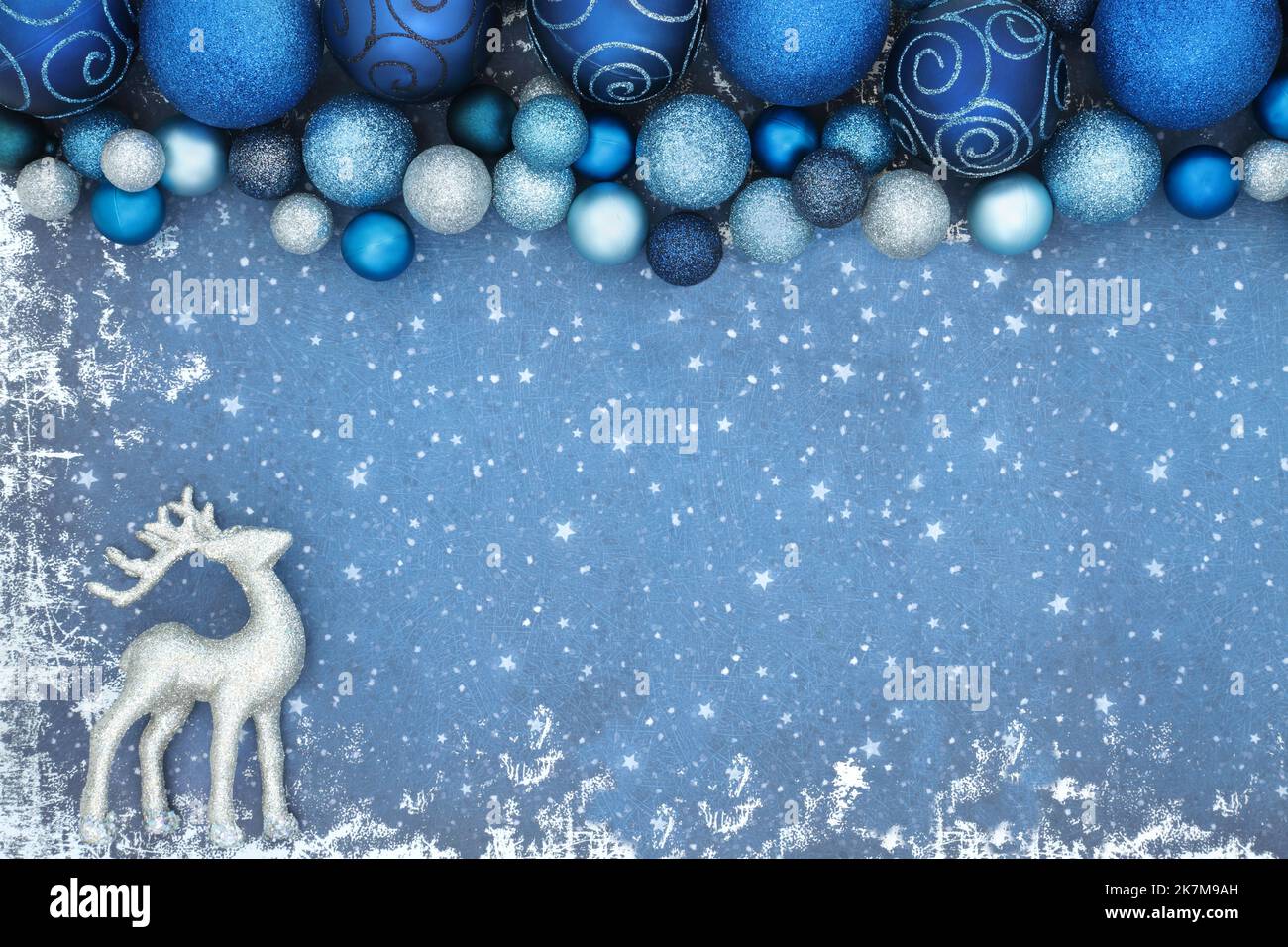 Christmas background with reindeer ornament and sparkling blue tree ...